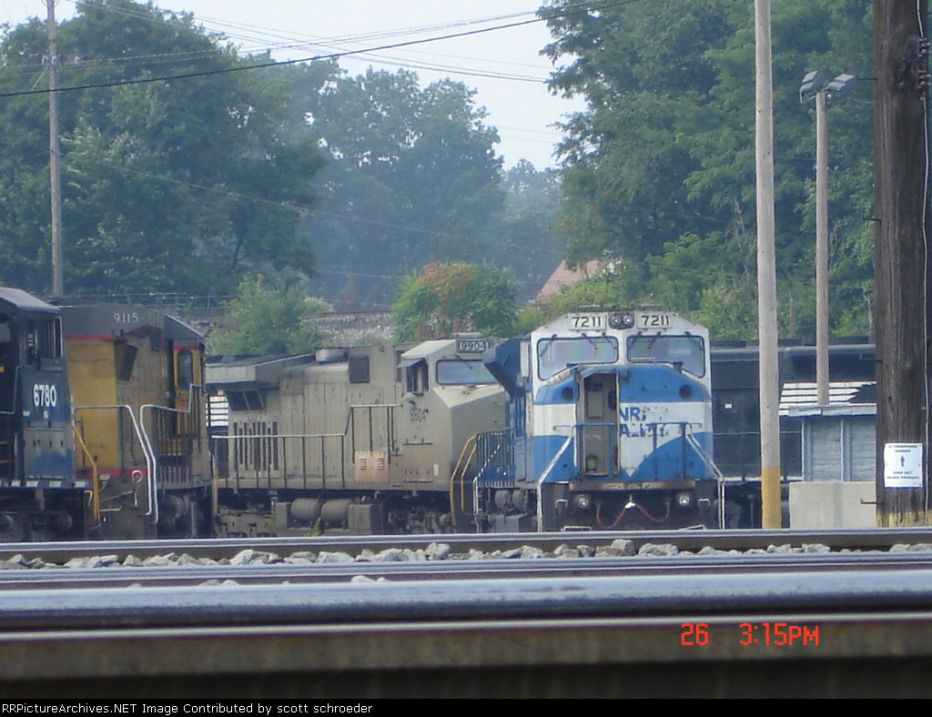 UP 9115, NS (ex.-CR) 7211 & NS 9904 all wait to get fuel at the Engine House